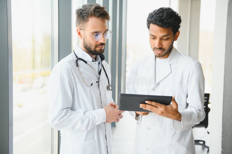An Indian Doctor and an Arab Doctor in a Hospital Stock Image - Image ...