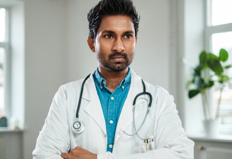 Indian Doctor with Stethoscope Around Neck in His Office Stock Image ...
