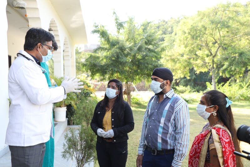 Indian Doctors Discussing with Patients about COVID-19 Stock Photo ...