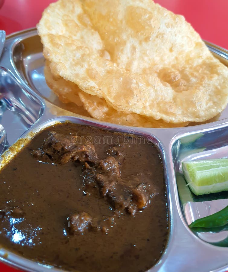 Indian Duck Curry with Luchi Served in an Indian Restaurant on a ...