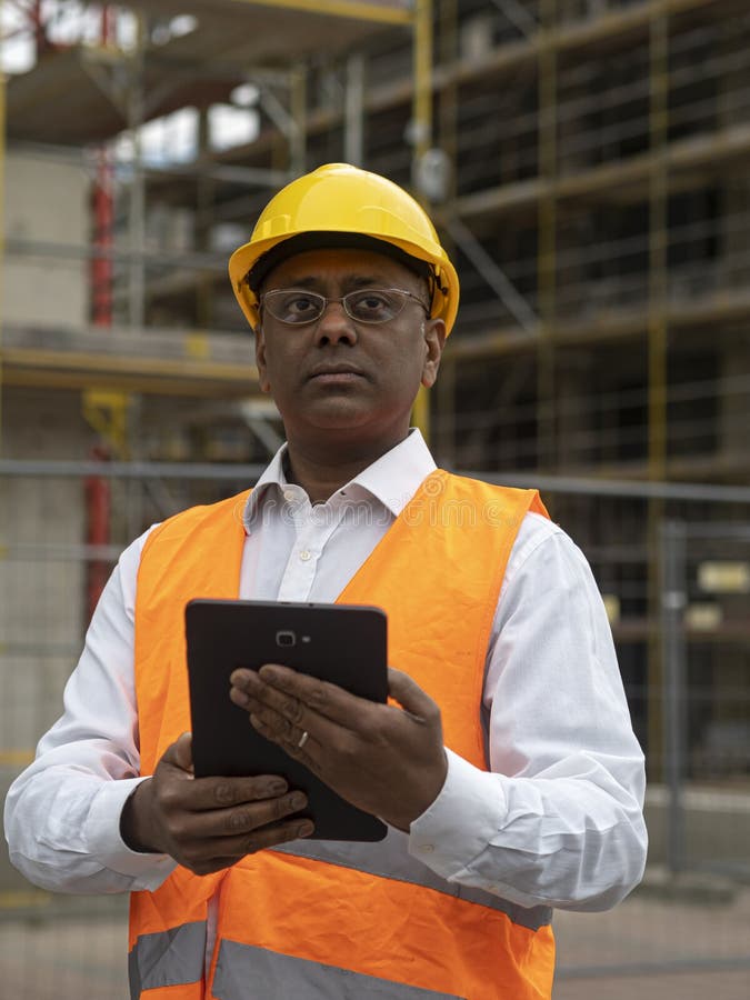 Indian Engineer Posing Holding a Digital Tablet Stock Photo - Image of ...