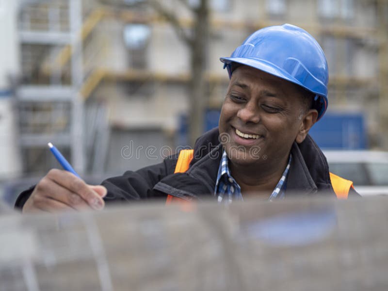Indian Engineer at Work Writing Outdoors Stock Image - Image of ...