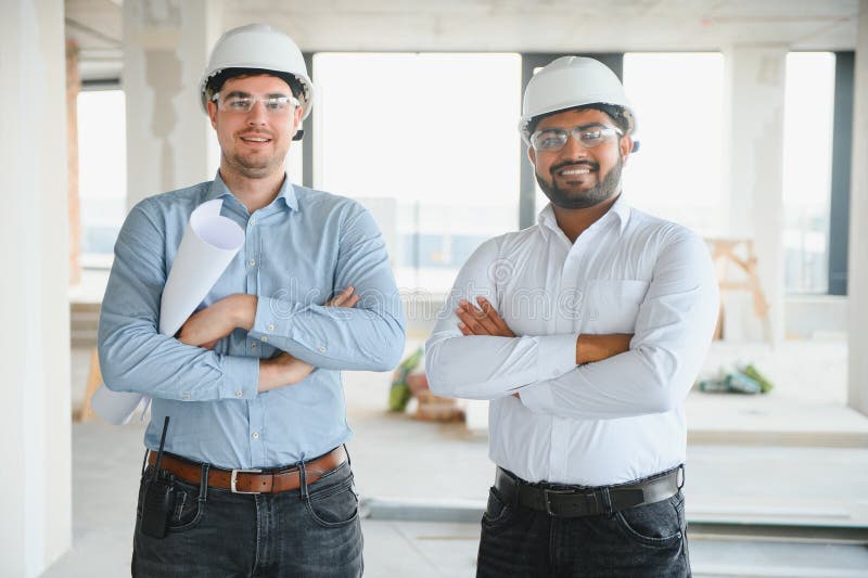Indian and European Construction Workers Together at a Construction ...