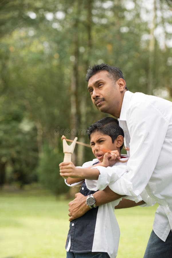 Indian Father and Son Playing Stock Photo - Image of summer, bonding ...