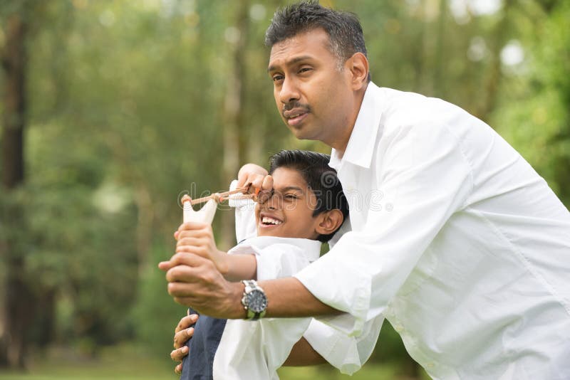 Indian Father and Son Playing Stock Photo - Image of game, wooden: 60152656