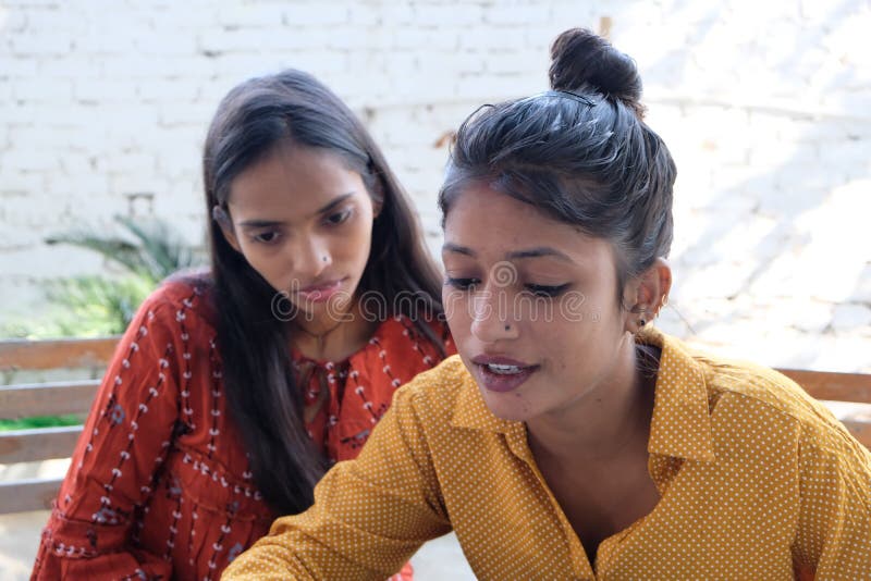Indian Female Friends Talking and Discussing Something Stock Photo ...