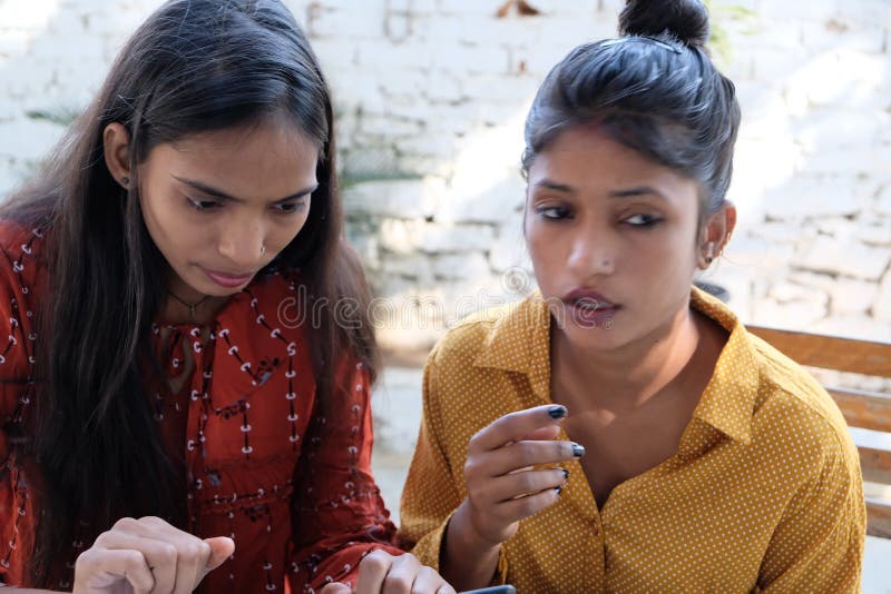 Indian Female Friends Talking and Discussing Something Stock Image ...