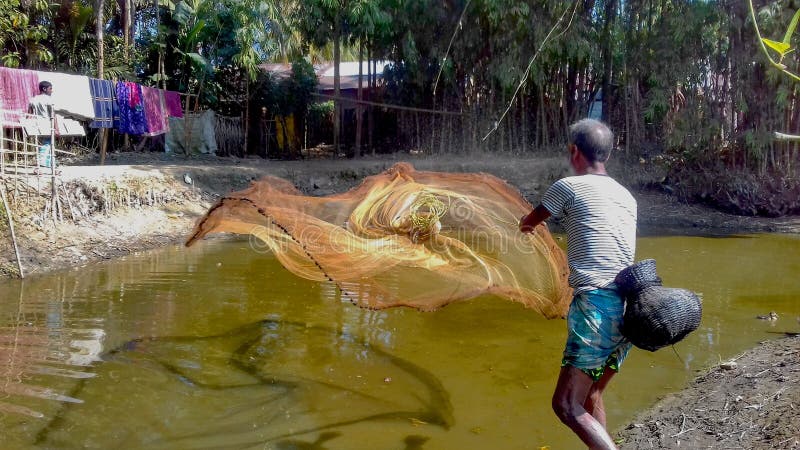 Indian Fisher Man Throwing Net in Lake. Editorial Photo - Image of ...