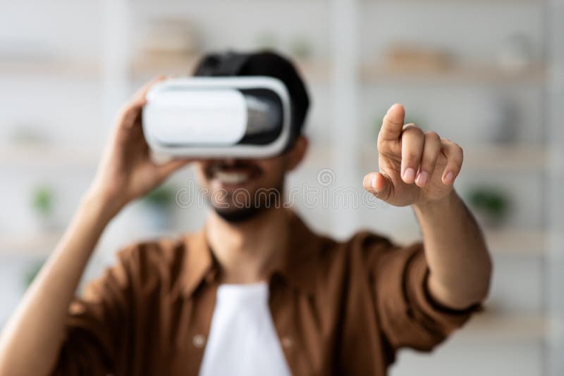 Indian Guy Using VR Glasses, Pointing at Camera, Closeup Portrait Stock ...