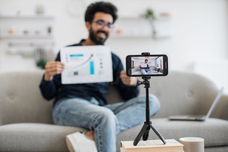 Indian Guy with Chart Recording Video on Smartphone in Room Stock Image ...