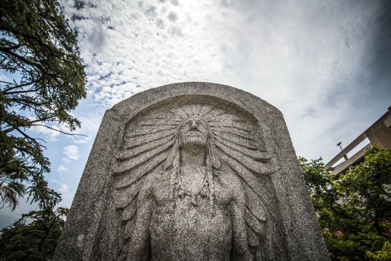 Red Indian S Head Sculpture on Yellow Wall Stock Image - Image of ...
