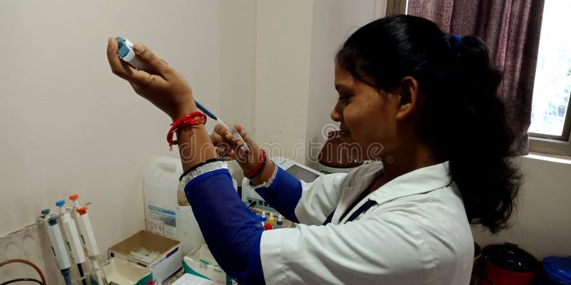 An Indian Lab Technician Girl Checking Samples at Laboratory Editorial ...