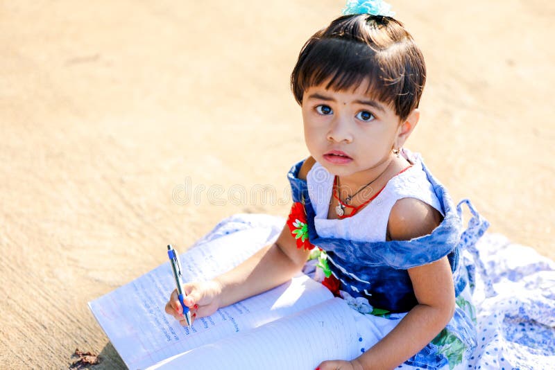 Indian Little Girl Child Writing on Note Book , Studying Stock Image ...