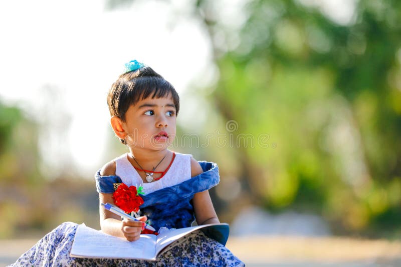 Indian Little Girl Child Writing on Note Book , Studying Stock Image ...