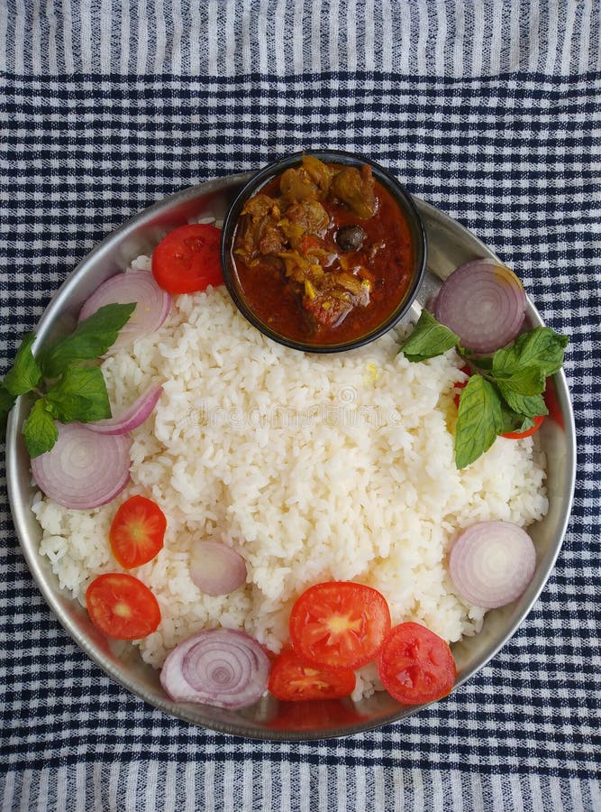 An Indian Lunch Meal Rice and Chicken Curry with Salad. Stock Photo ...
