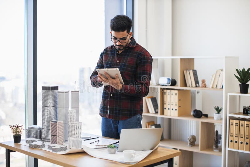 Indian Architect Using Digital Tablet for City Project in Office Stock ...