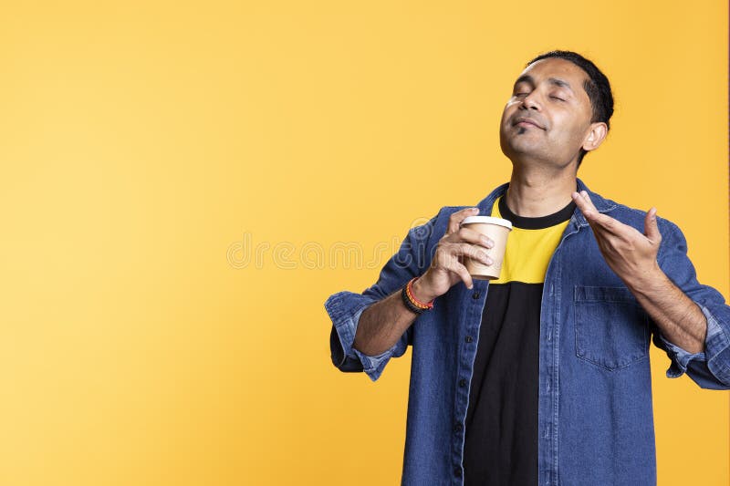 Indian Male Model Feeling Energized after Drinking a Cup of Coffee ...