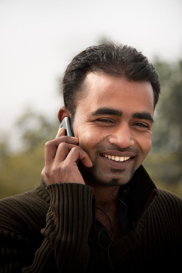 Indian Man Busy on Cell Phone Stock Image - Image of good, looking ...
