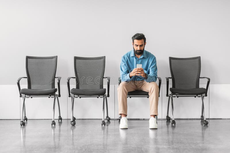 Indian Man Checking Phone while Waiting for Interview Stock Image ...