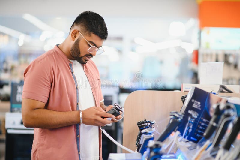 Indian Man Choosing Trimmer at Electric Store Stock Image - Image of ...