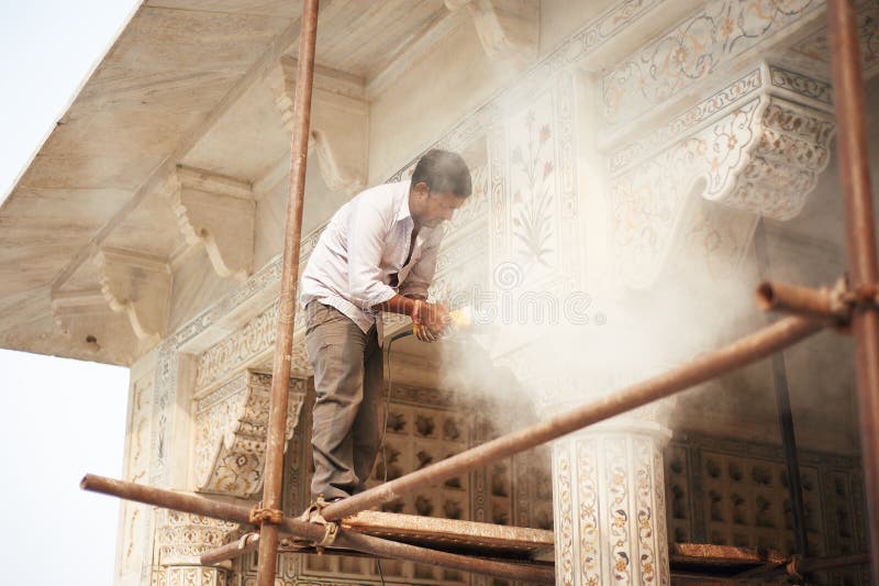 Indian Man Doing Restoration Work by Grinder Tool. Agra Fort, Agra ...