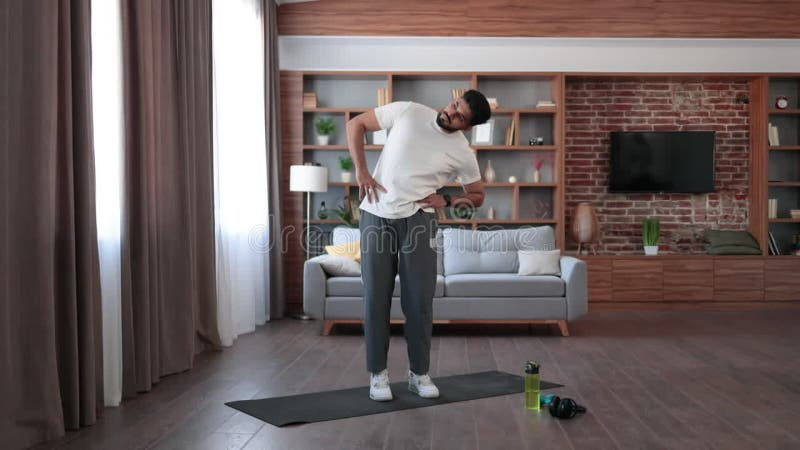 Indian Man Doing Side Tilts with Hands on Hips at Home Stock Footage ...