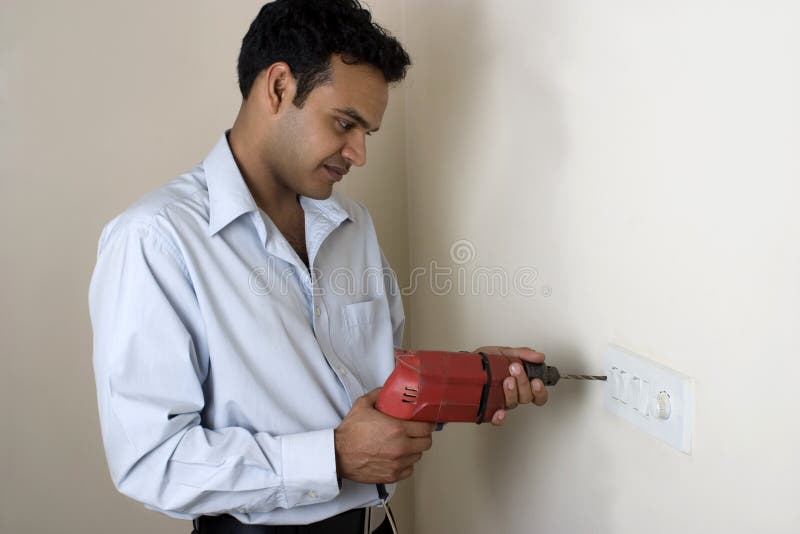 Indian Man Drilling Hole in a Wall Stock Image - Image of drilling ...