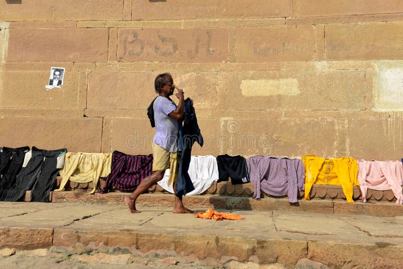 Indian Man Drying Clothes editorial stock photo. Image of facade - 27955788