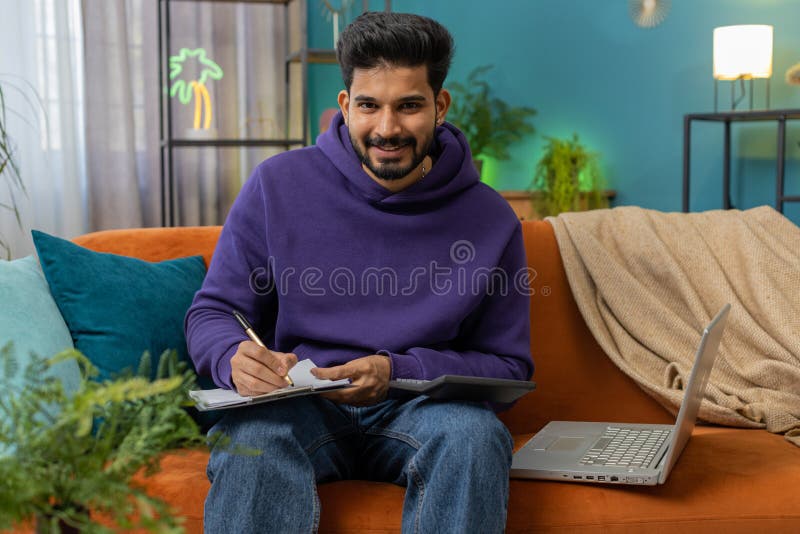 Indian Man Freelancer Work with Documents from Home, Analyzing ...