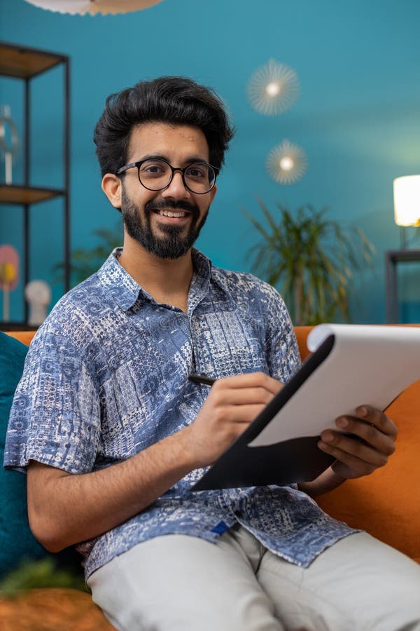 Indian Man Freelancer Work with Documents from Home, Analyzing ...