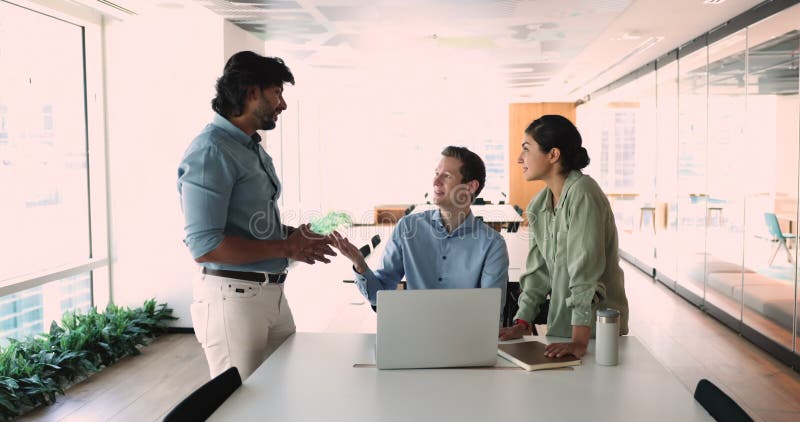 Indian Man Leader Explains Work Tasks To Young Colleagues Stock Footage ...