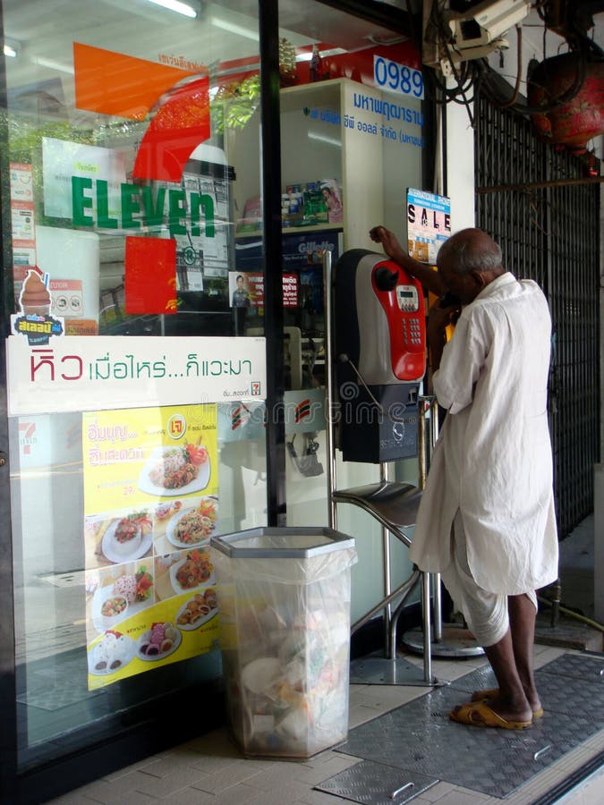 Indian Man Makes a Call Using a True Public Phone in Front of a 7/11 ...