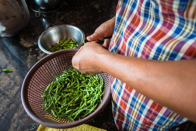 An Indian Man Processing Green Pigeon Pea Vegetable in the Kitchen ...