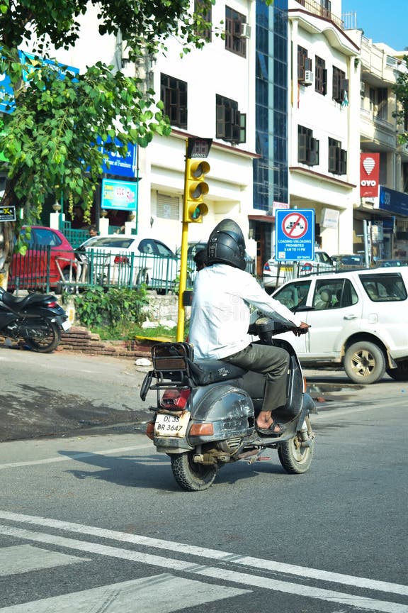 Indian man riding scooter editorial stock photo. Image of motorized ...