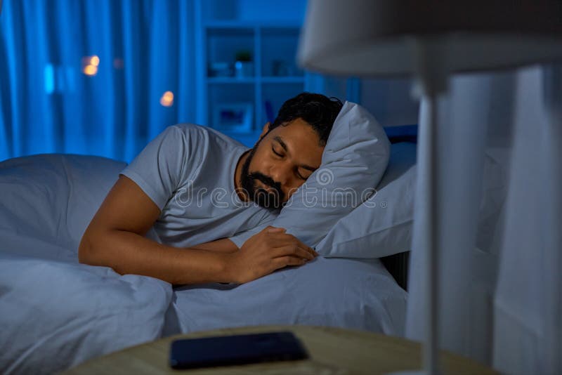 Indian Man Sleeping in Bed at Home at Night Stock Photo - Image of ...