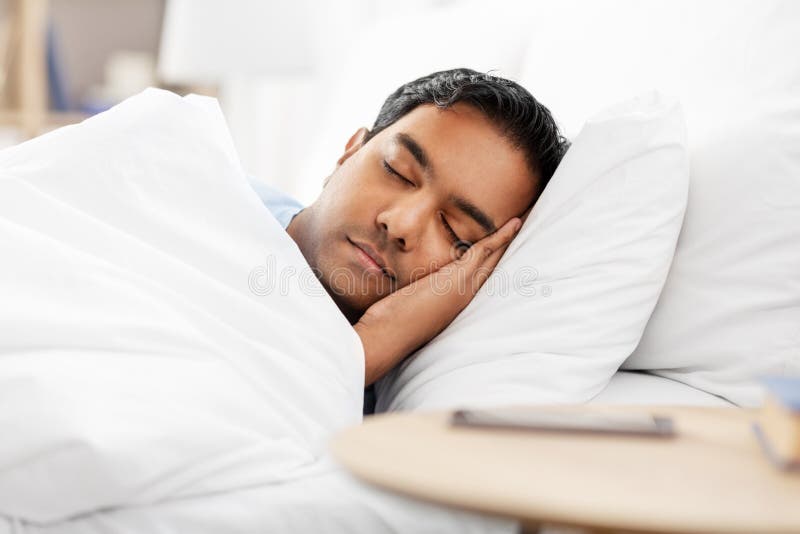 Indian Man Sleeping in Bed at Home Stock Photo - Image of comfort ...