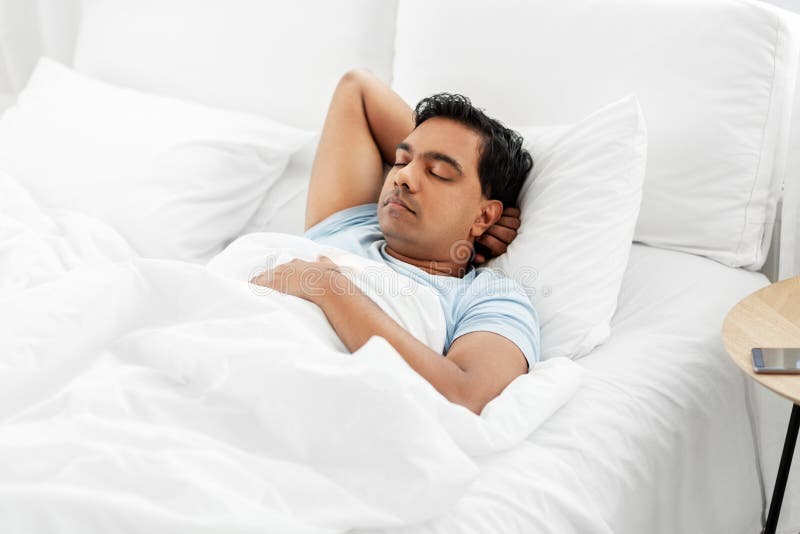 Indian Man Sleeping in Bed at Home Stock Image - Image of bedding ...