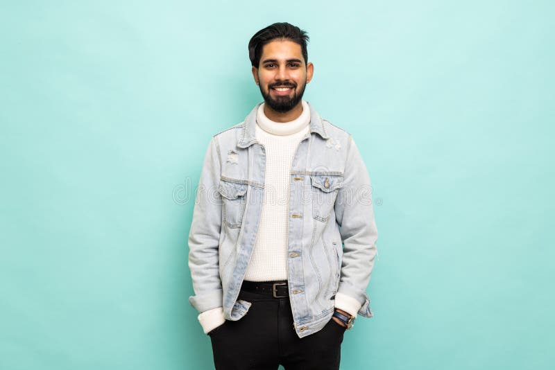 Smiling Indian Man Standing in Front of Turquoise Wall Stock Photo ...