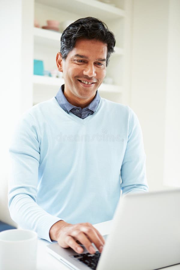 Indian Man Using Laptop at Home Stock Photo - Image of relaxing ...