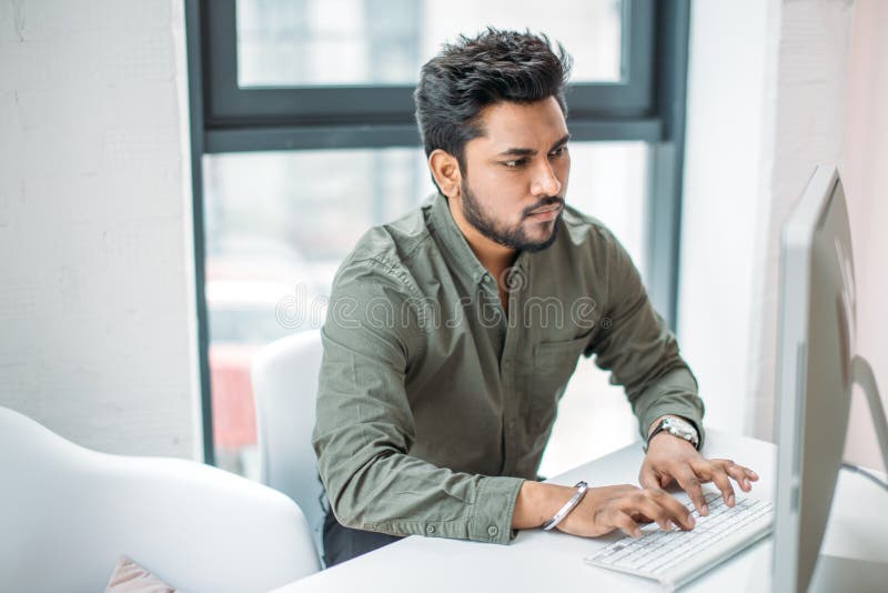 Indian Man Working at Computer from Modern Bright Office Stock Image ...