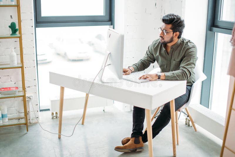 Indian Man Working at Computer from Modern Bright Office Stock Image ...