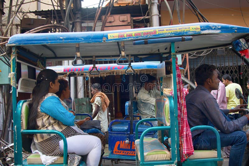 Indian Men Try To Fix The Motor Of An Old Riverboat At The Ganges River ...