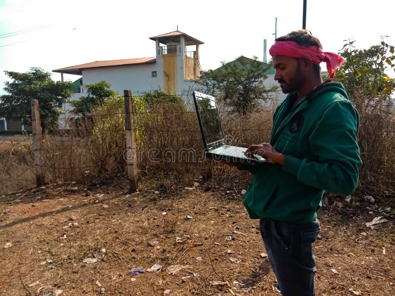 Indian Poor Boy Operating Laptop Computer System at Soil Field in India ...