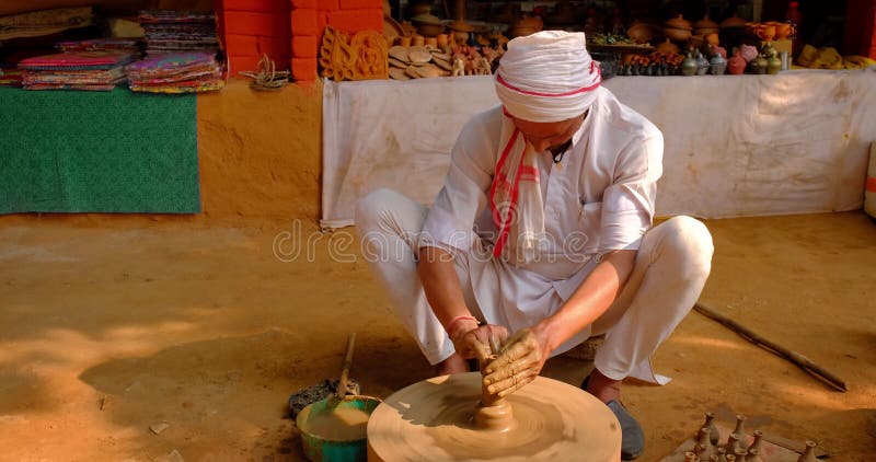 Indian Potter at Work Throwing the Potter S Wheel and Shaping Clay Ware ...