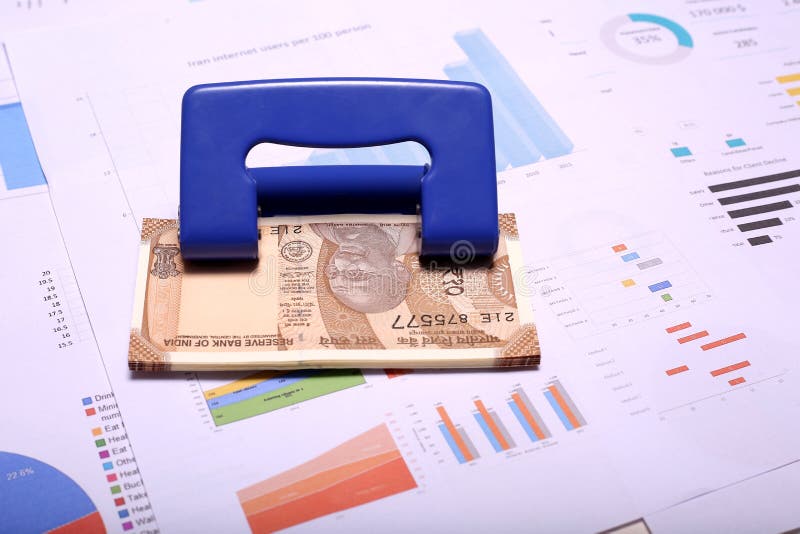 Indian 10 Rupee Currency Notes and Punching Machine on the Chart Paper ...