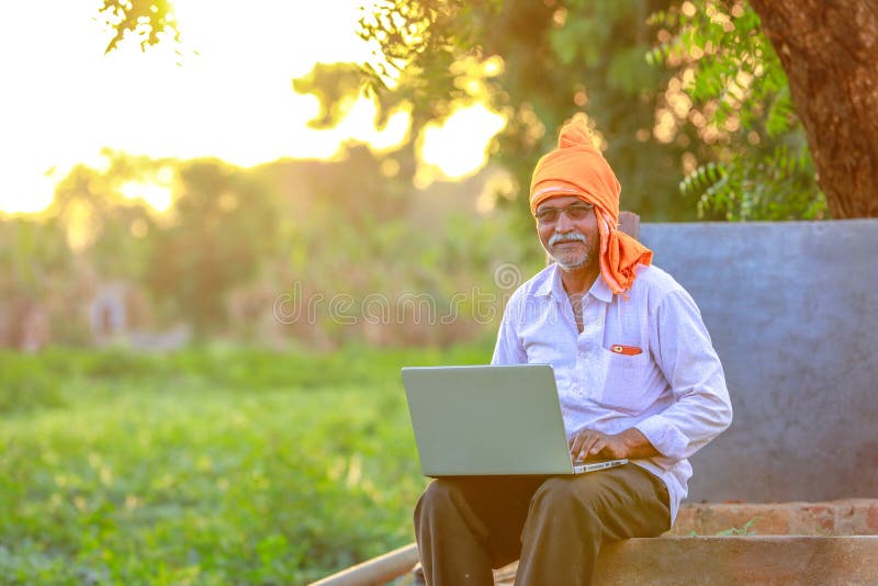 Indian Rural Farmer Using Laptop Stock Photo - Image of indian, kurta ...