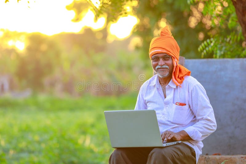 Indian Rural Farmer Using Laptop Stock Photo - Image of countryside ...