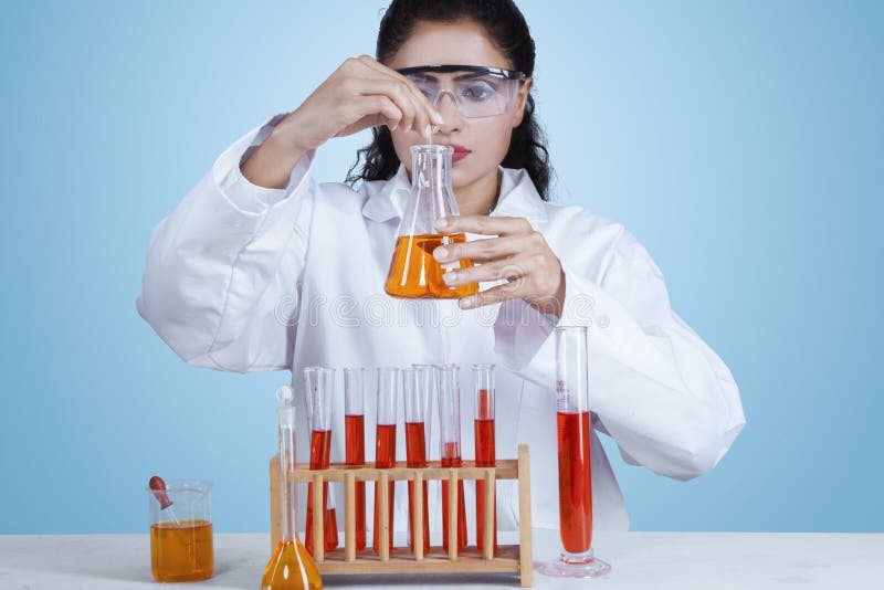 Indian Scientist Making Experiment Stock Photo - Image of liquid, adult ...