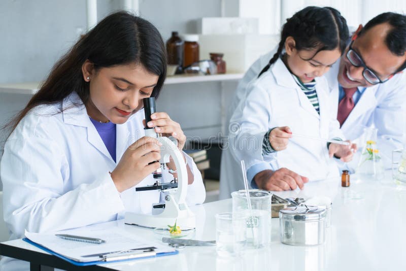 Indian Scientist Woman Student Using Microscope Do an Experiment at ...