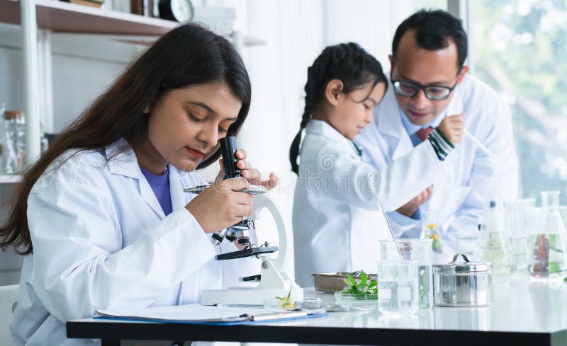 Indian Scientist Woman Student Using Microscope Do an Experiment at ...